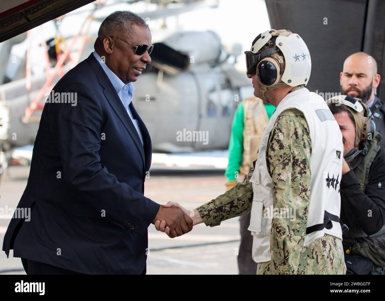 U.S. Secretary of Defense, Lloyd Austin III, left, is greeted by Adm ...