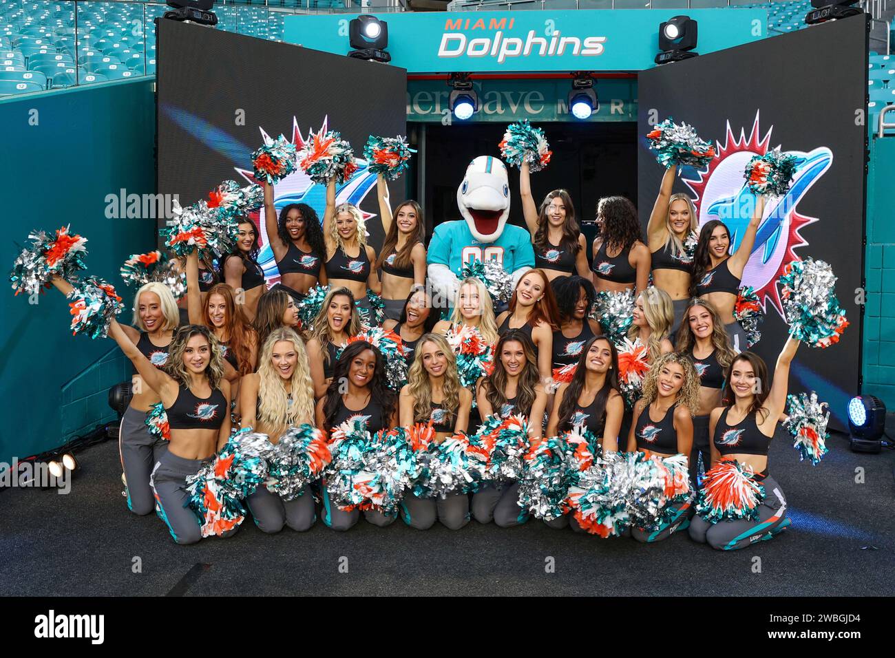 Dolphin cheerleaders pose before an NFL football game against the ...