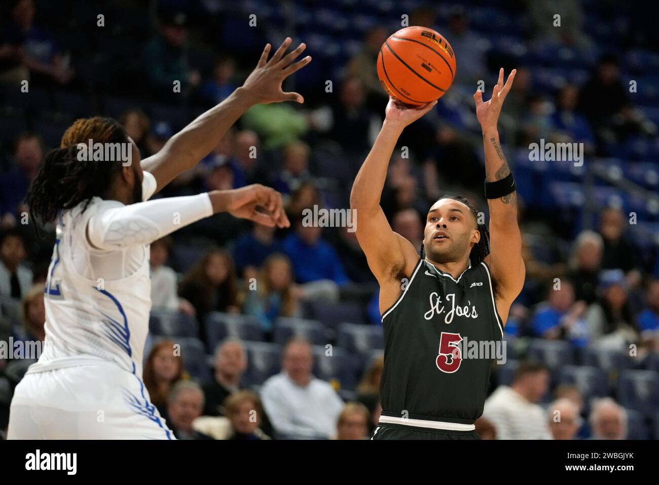 Saint Joseph's guard Lynn Greer III (5) shoots over Saint Louis forward ...