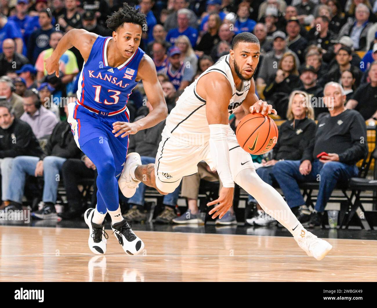 January 10, 2024: UCF Knights guard Darius Johnson (3) dribbles the ball around Kansas Jayhawks ...