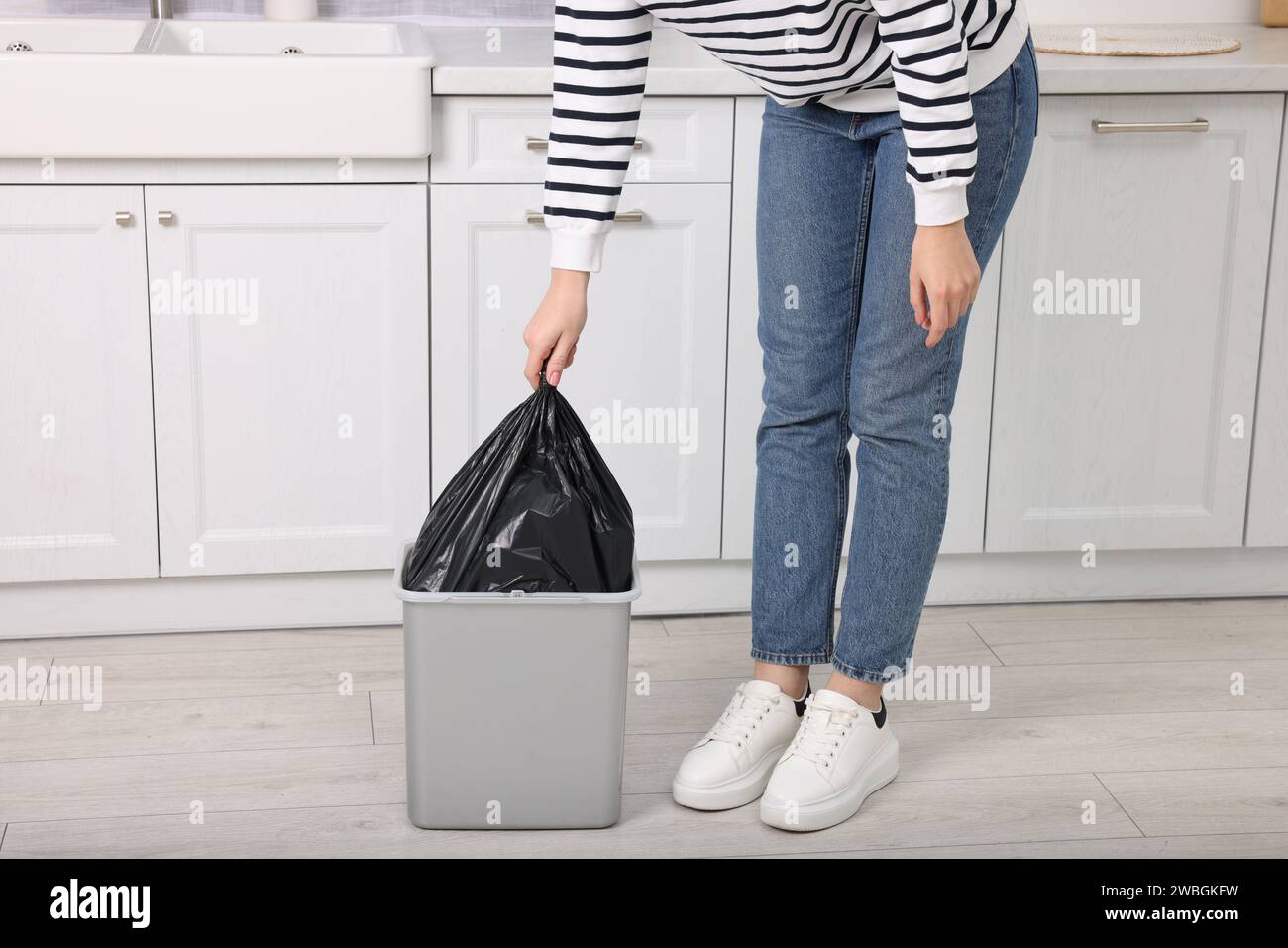 Taking out rubbish female hi-res stock photography and images - Alamy