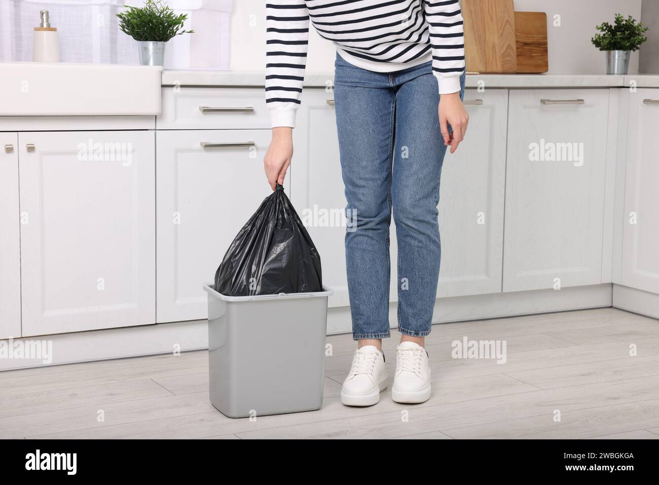Taking out rubbish female hi-res stock photography and images - Alamy