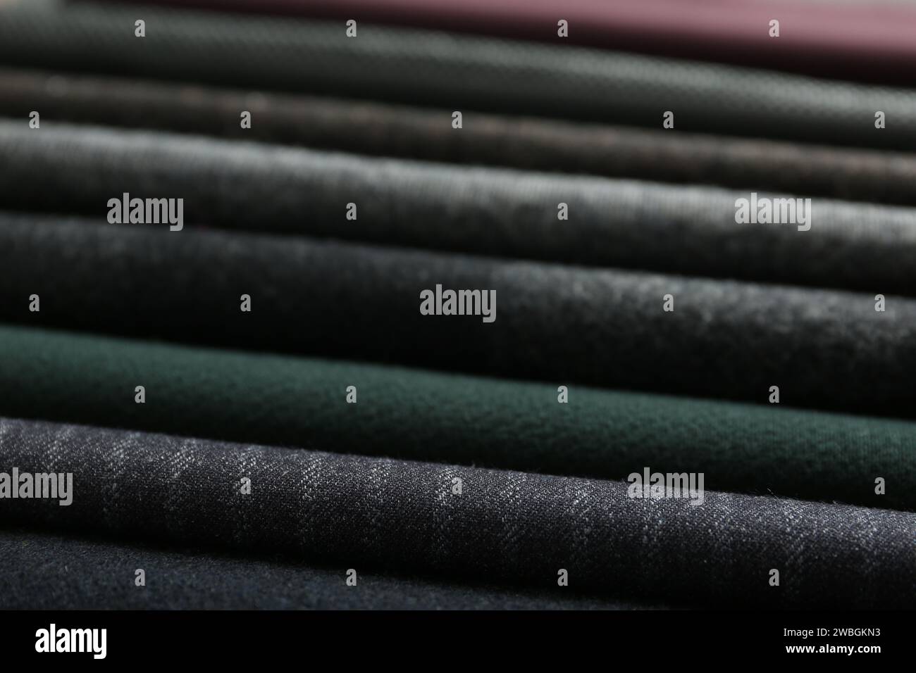Stack of different fabric samples as background, closeup. Textile ...