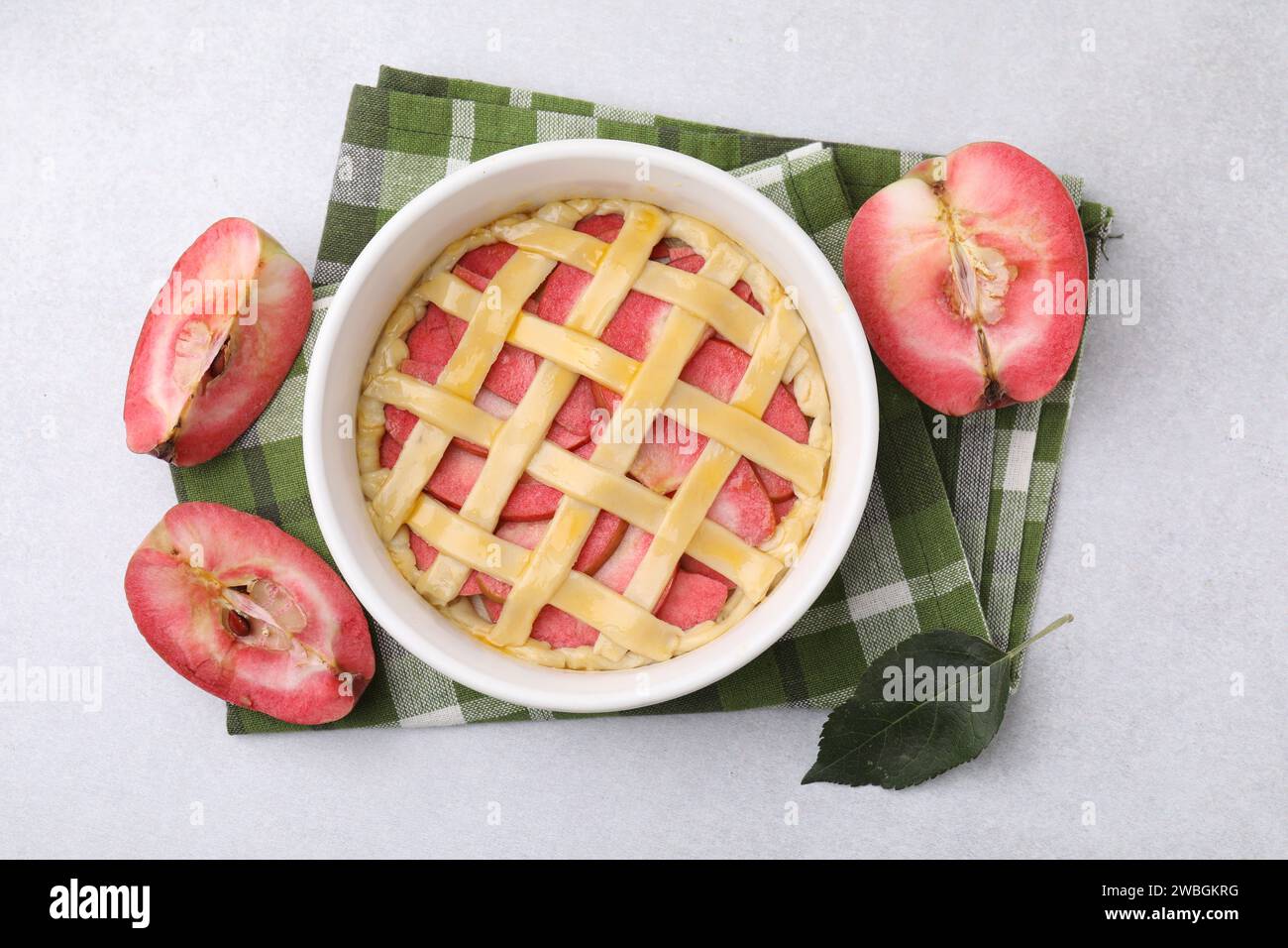 Raw apple pie and fruit on light grey textured table, top view Stock ...