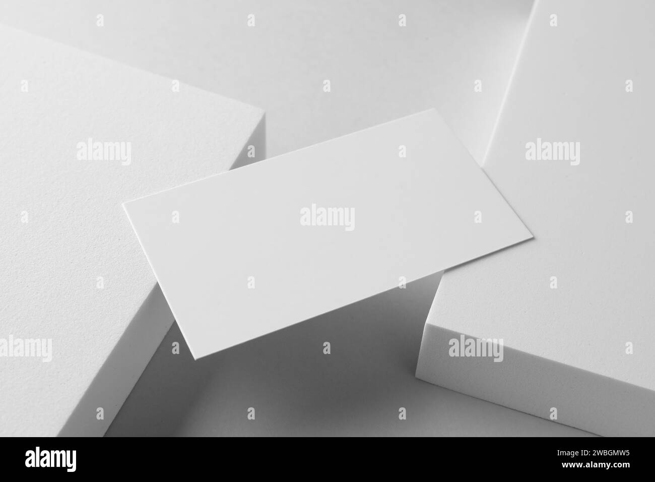 Empty business card and decorative elements on white background. Mockup ...