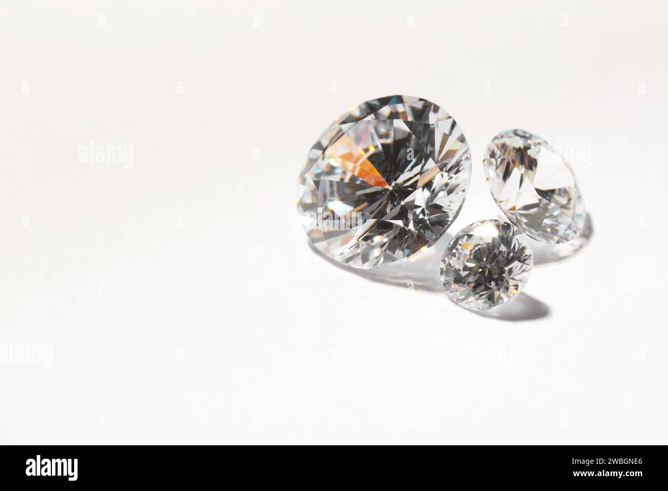 Beautiful shiny diamonds on white background, space for text Stock ...