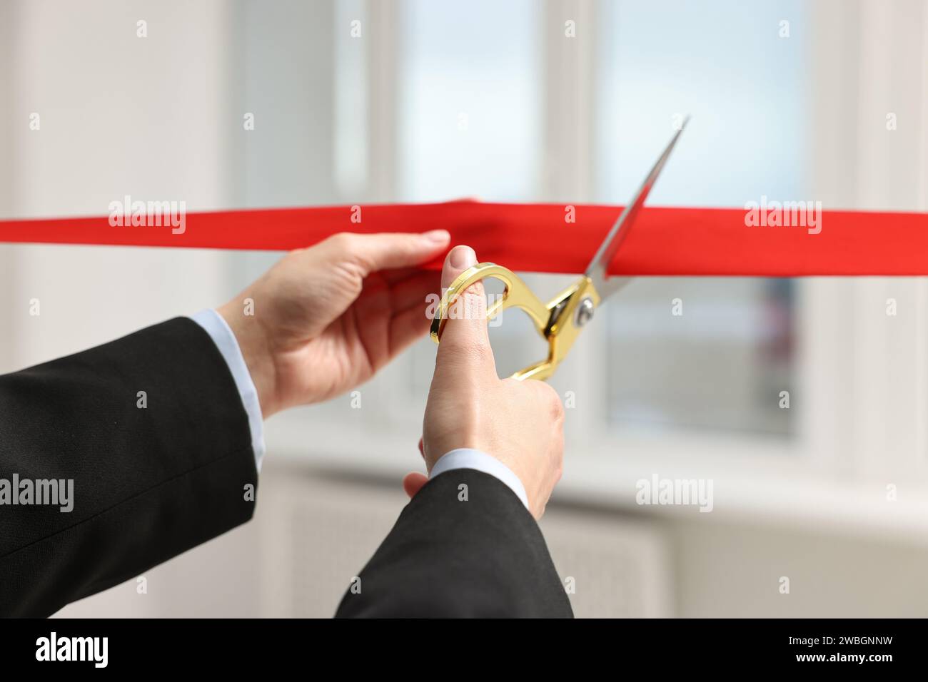 Woman cut red ribbon hi-res stock photography and images - Alamy