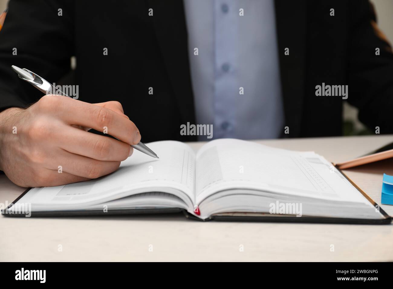 Male hand taking notes hi-res stock photography and images - Alamy