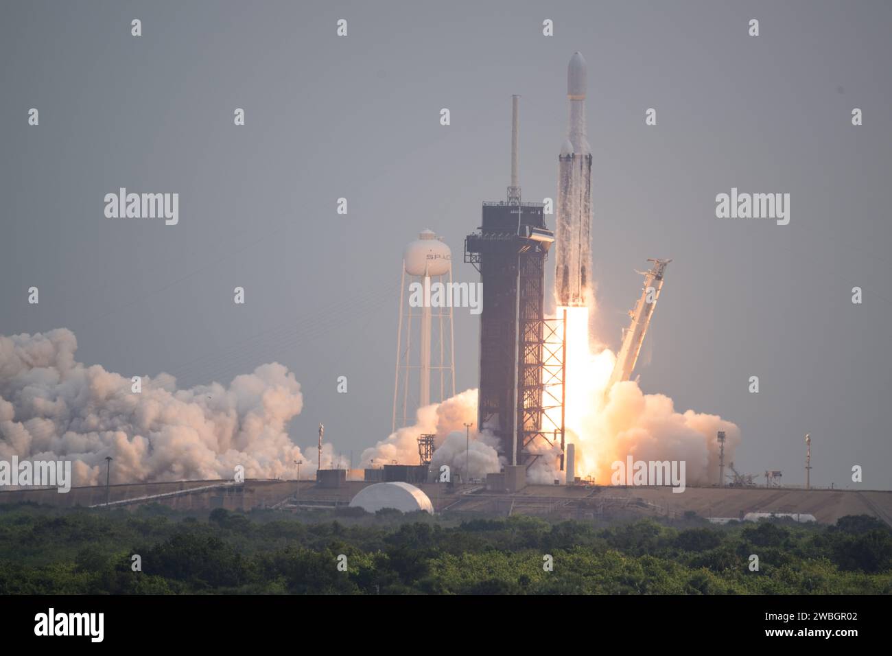 A SpaceX Falcon Heavy rocket with the Psyche spacecraft onboard is ...