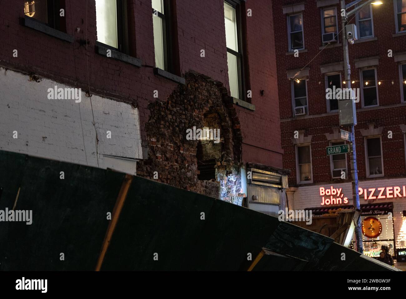 Partially collapsed exterior wall from a building on 188 Grand street ...