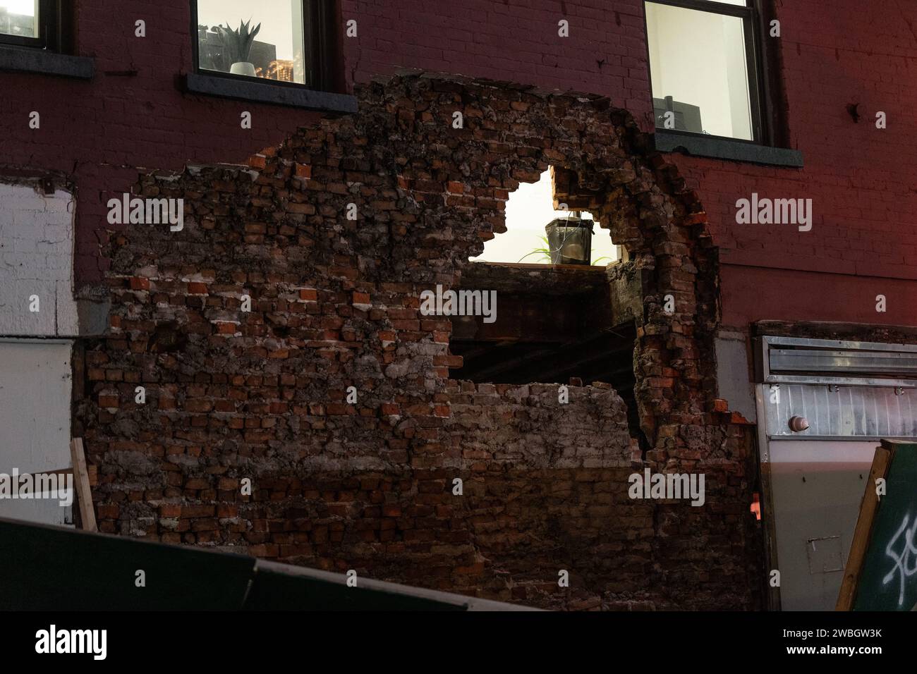 Partially collapsed exterior wall from a building on 188 Grand street ...