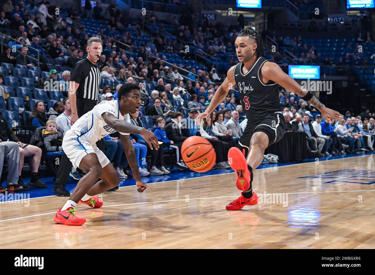 JANUARY 10, 2024: Saint Joseph's Hawks guard Lynn Greer III (5) blocks ...