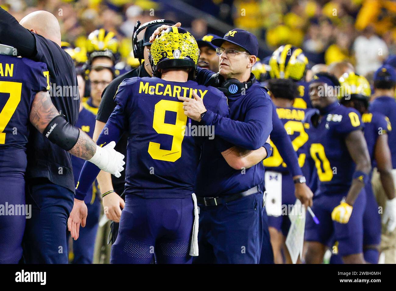 January 8, 2024: Michigan Wolverines head coach Jim Harbaugh hugs quarterback J.J. McCarthy (9 ...