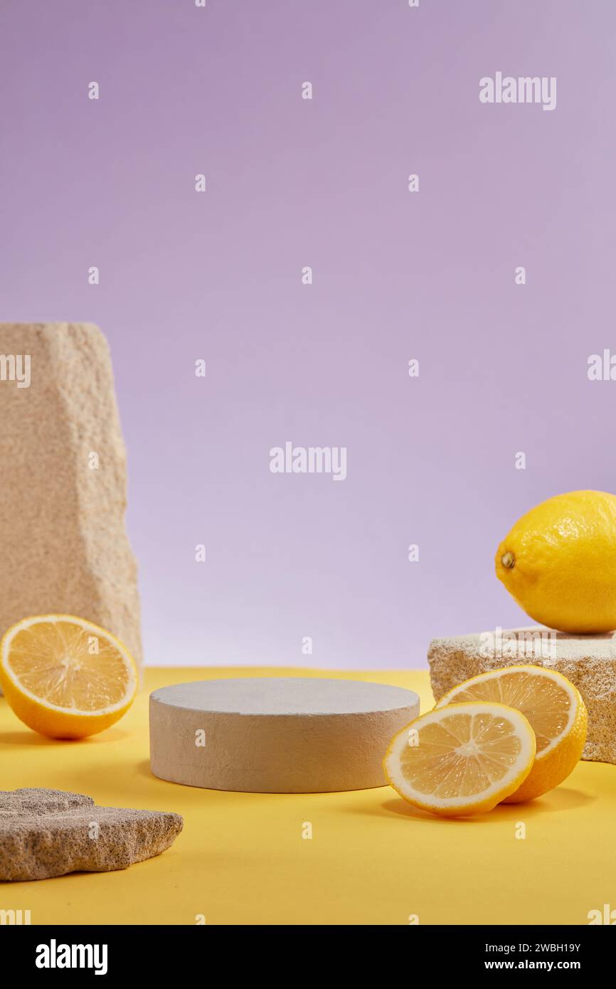 Against the purple background, fresh lemon and lemon slices decorated ...