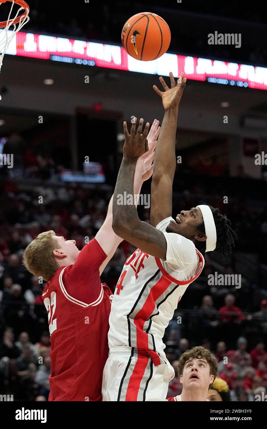 Ohio State center Felix Okpara, right, shoots over Wisconsin forward ...