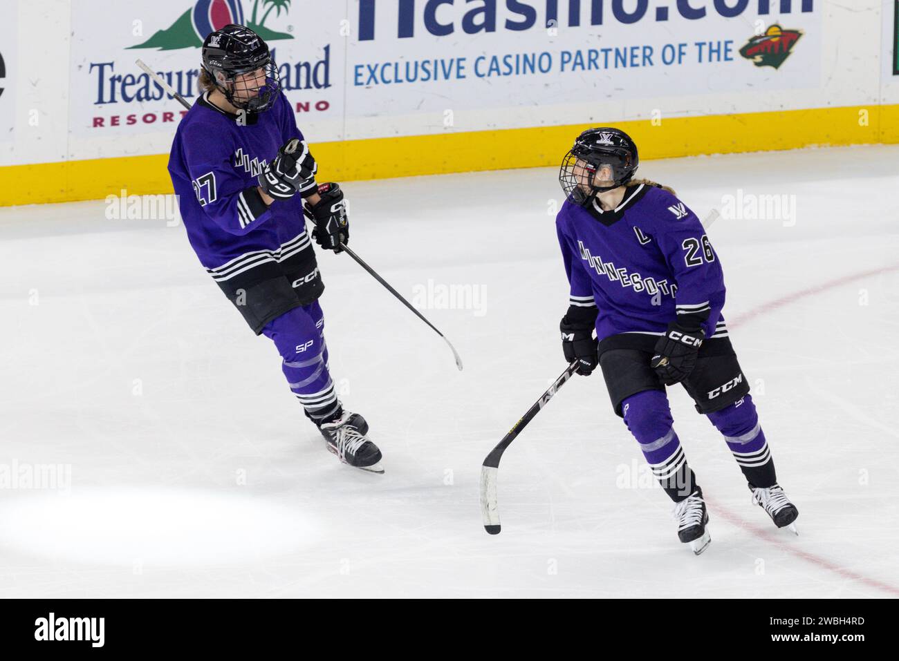 Minnesota forward Kendall Coyne (26) is congratulated by forward Taylor ...