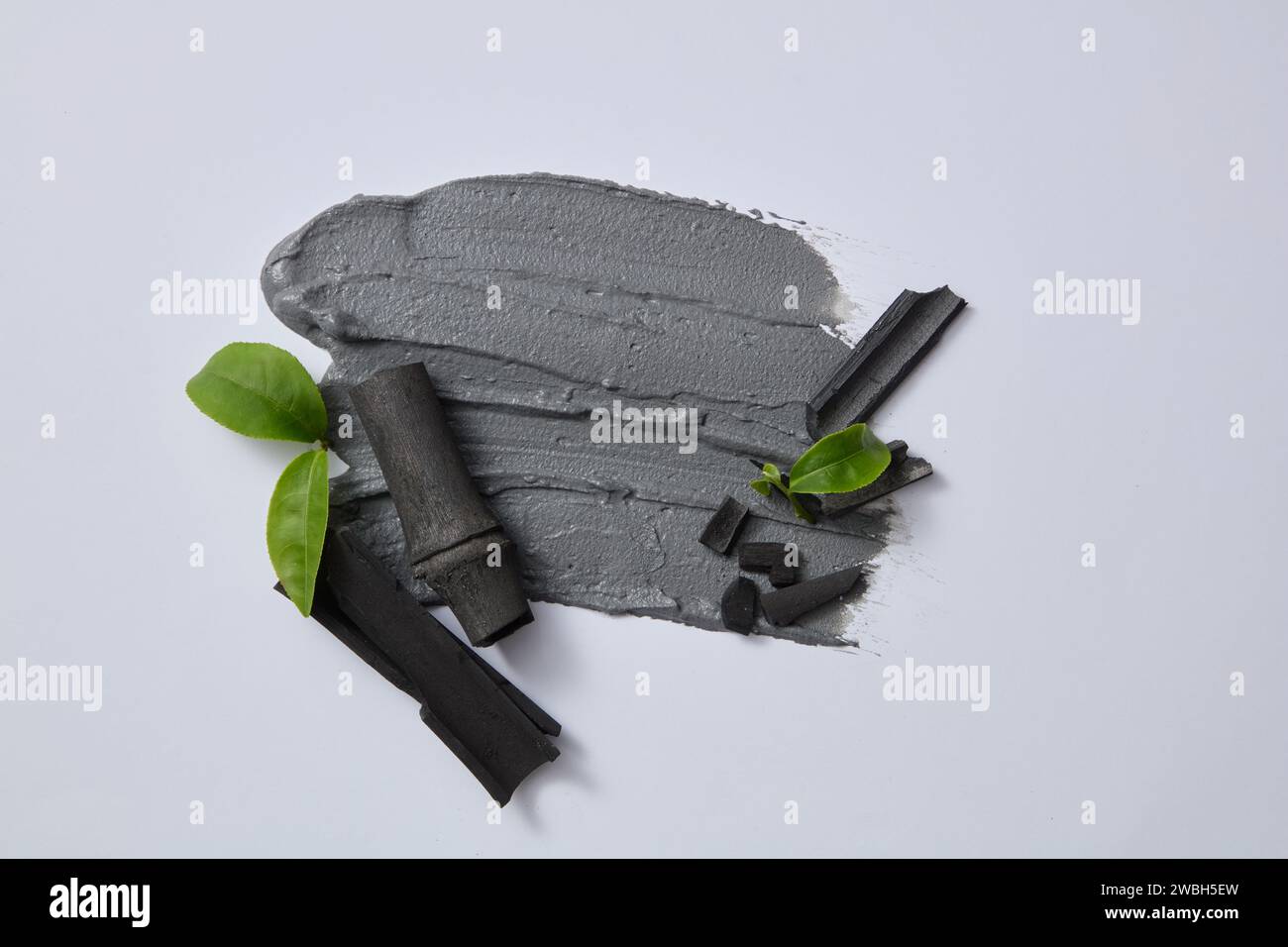 Clay mask texture decorated on gray background with activated bamboo ...
