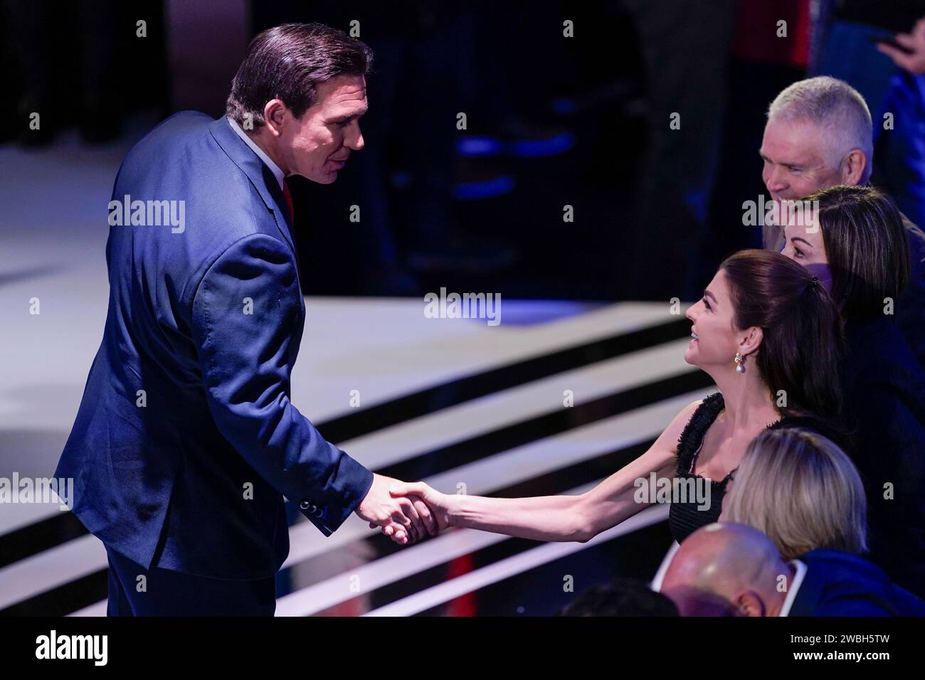 Florida Gov. Ron DeSantis, left, shaking the hand of his wife Casey ...