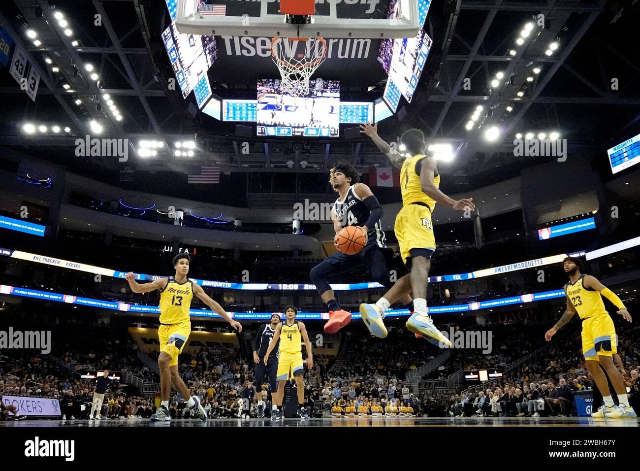 Butler's DJ Davis shoots past Marquette's Kam Jones during the second ...
