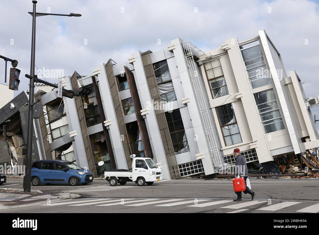Photo taken on Jan. 11, 2024, shows a toppled building in Wajima in the ...