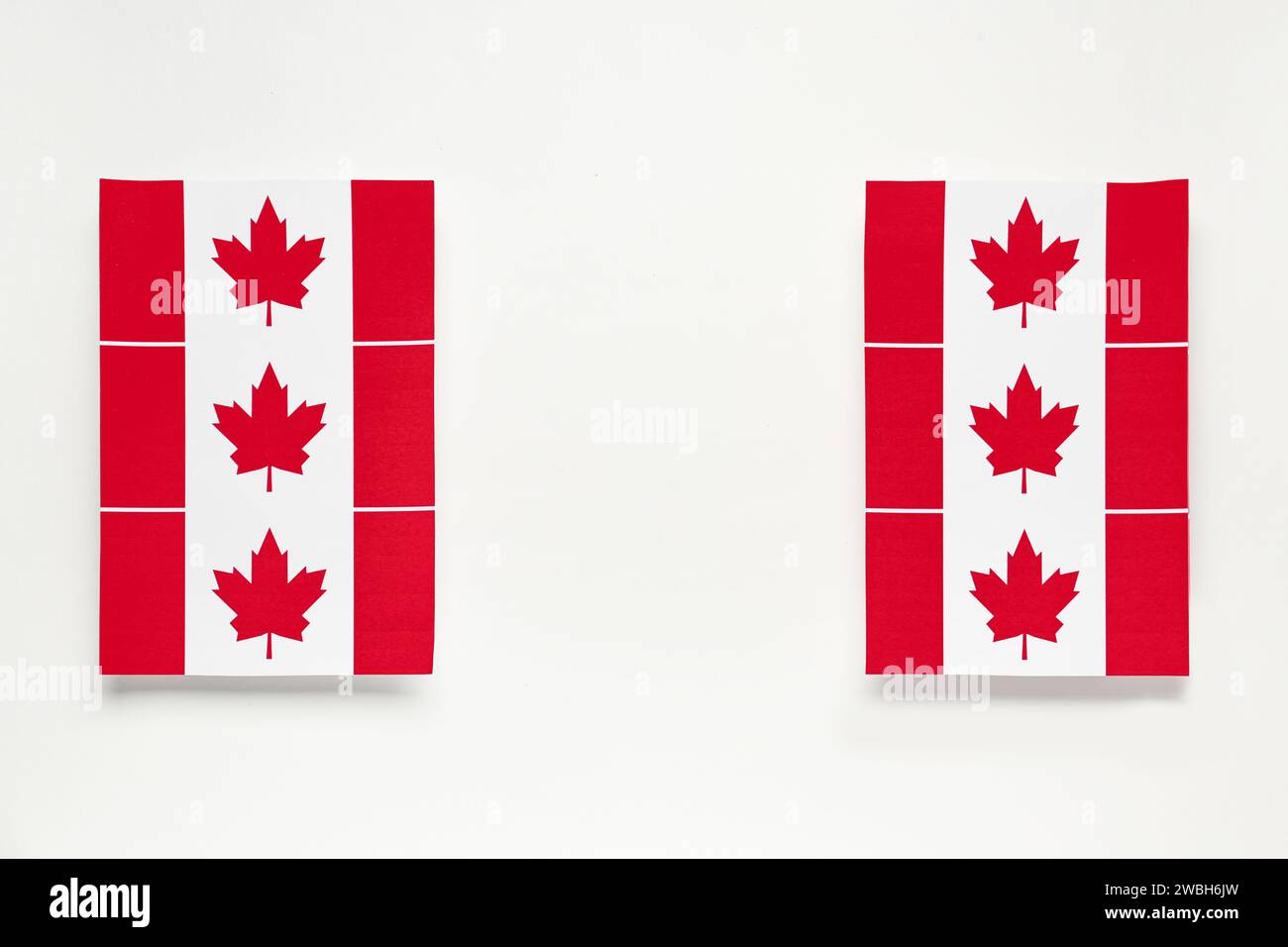 Frame made of Canadian flags on white background Stock Photo - Alamy