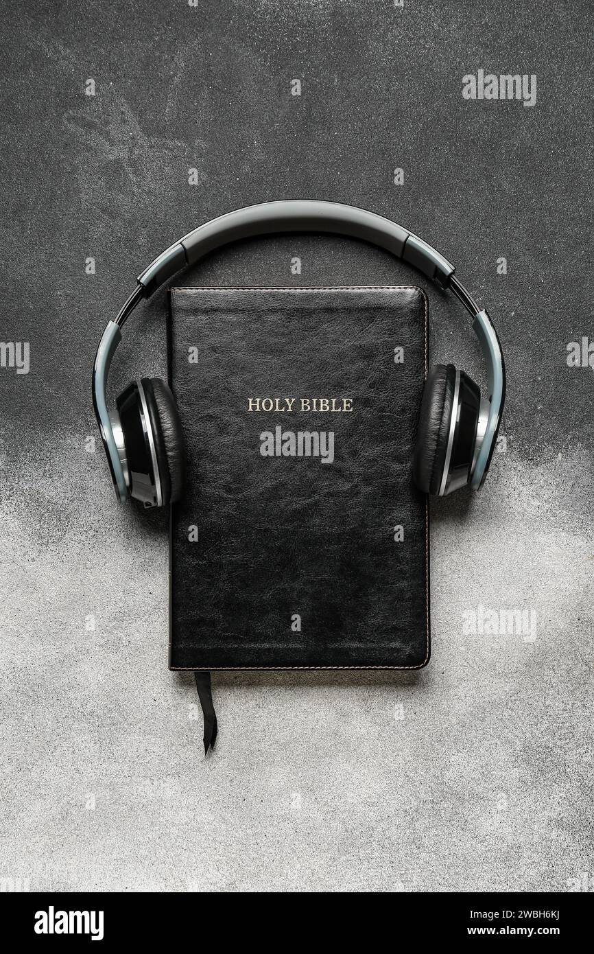 Holy Bible with headphones on grunge background Stock Photo - Alamy