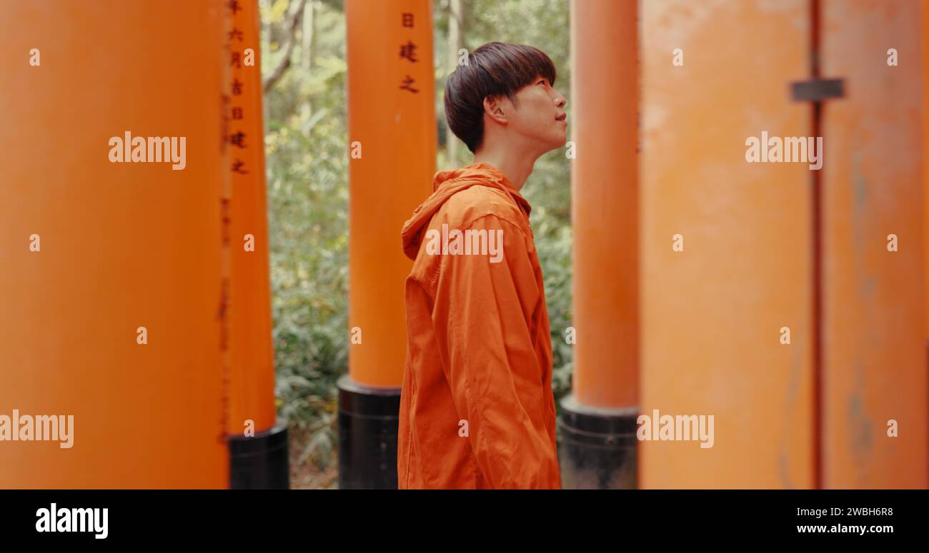 Japanese man, walk and torii gate for religion in shinto culture for ...