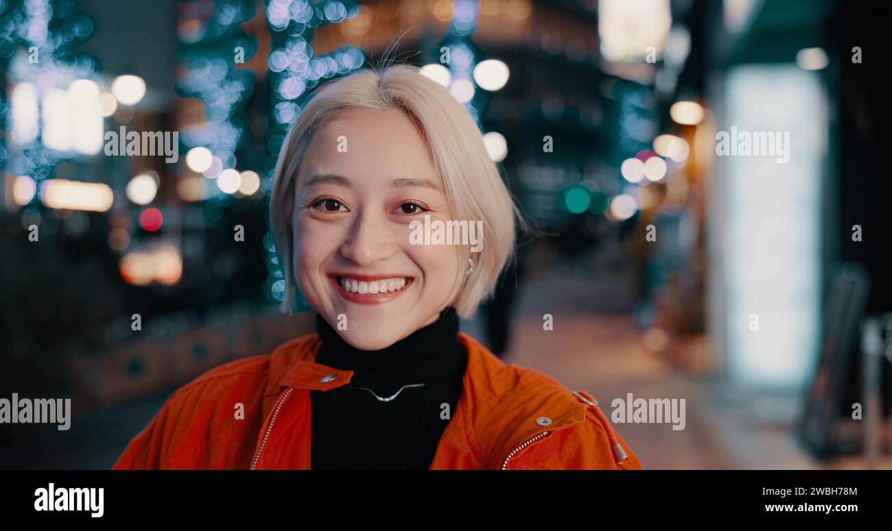 Portrait, happy woman and night in Japanese city of Tokyo with freedom ...