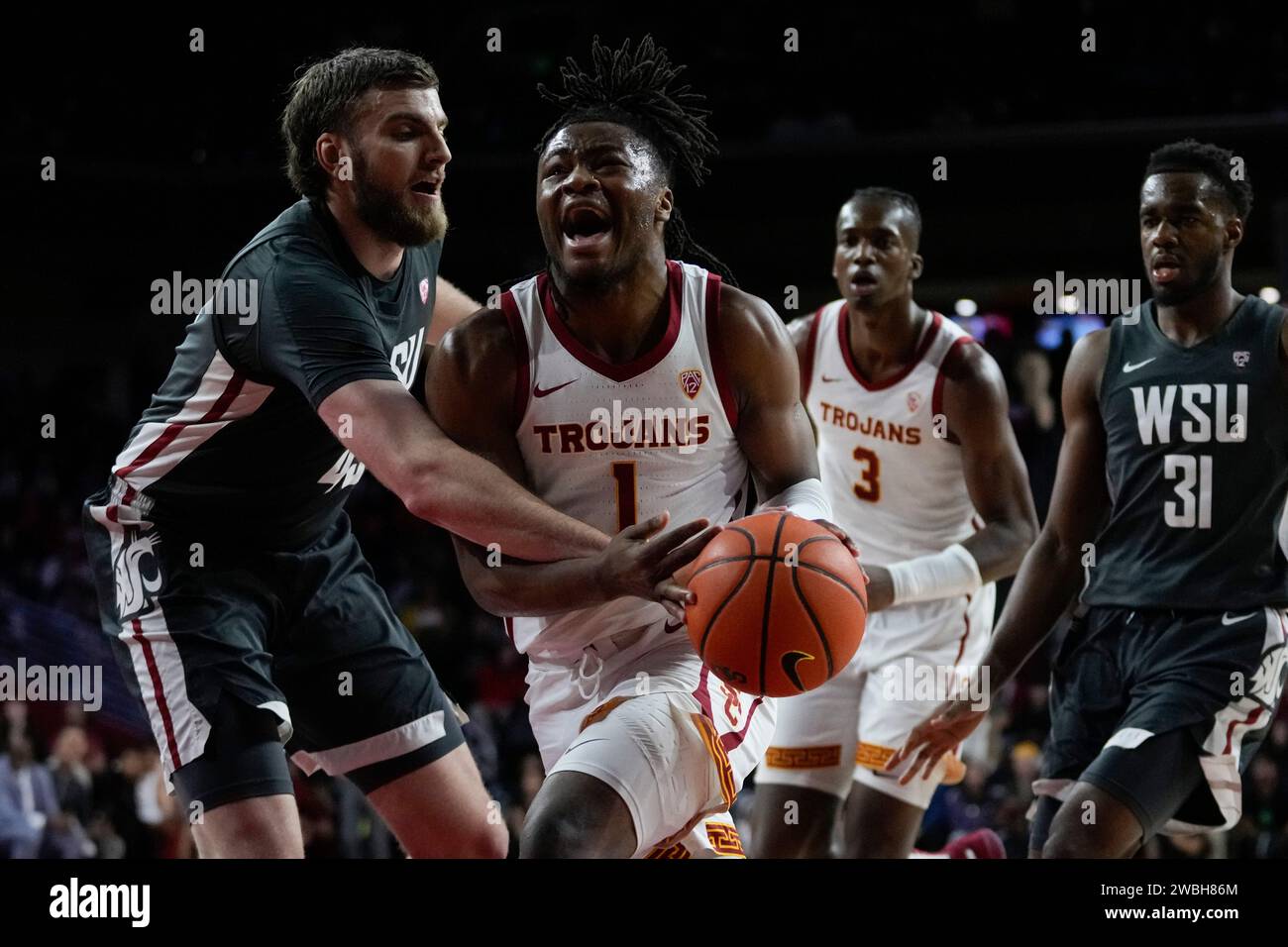 Washington State forward Oscar Cluff (45) fouls Southern California ...