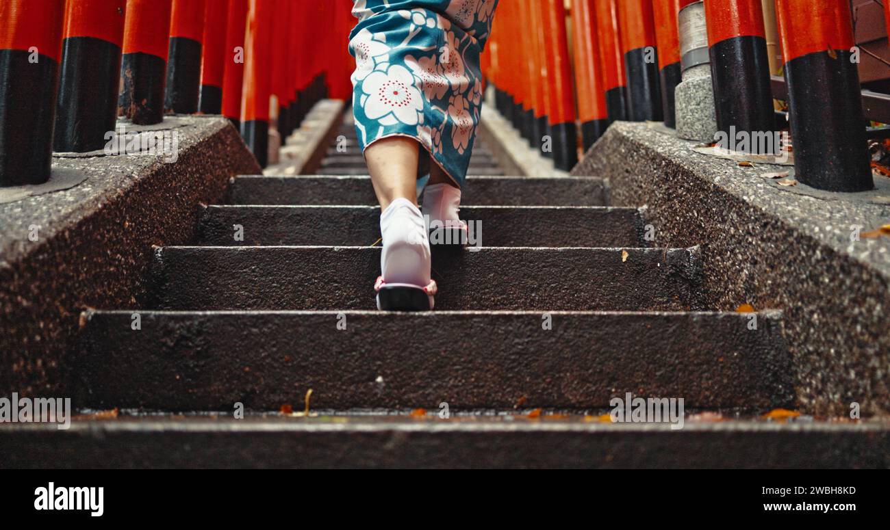 Woman, shinto culture or walk by stairs in japan, spiritual path or ...