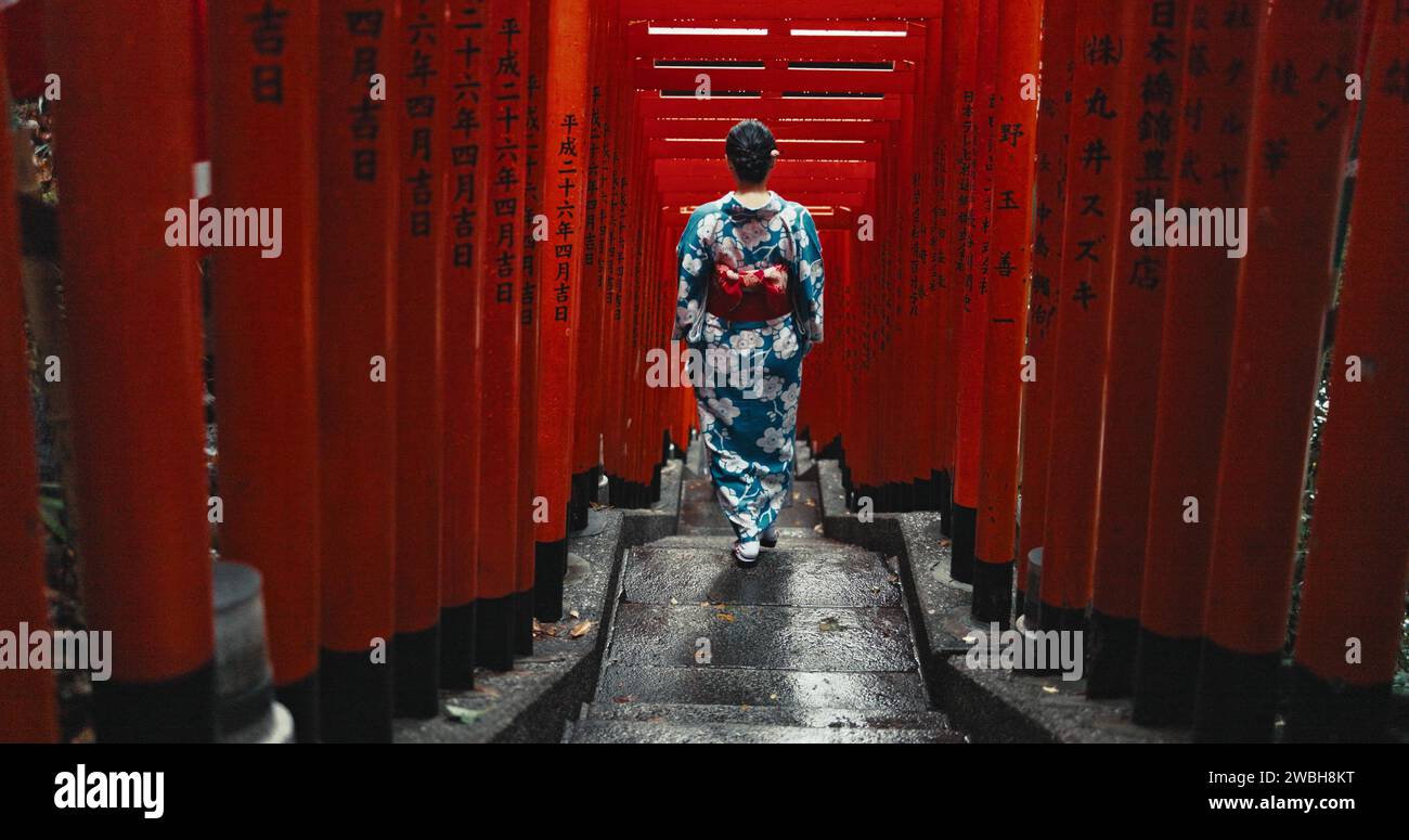 Woman, shinto religion and walk by gates in japan, spiritual path and ...