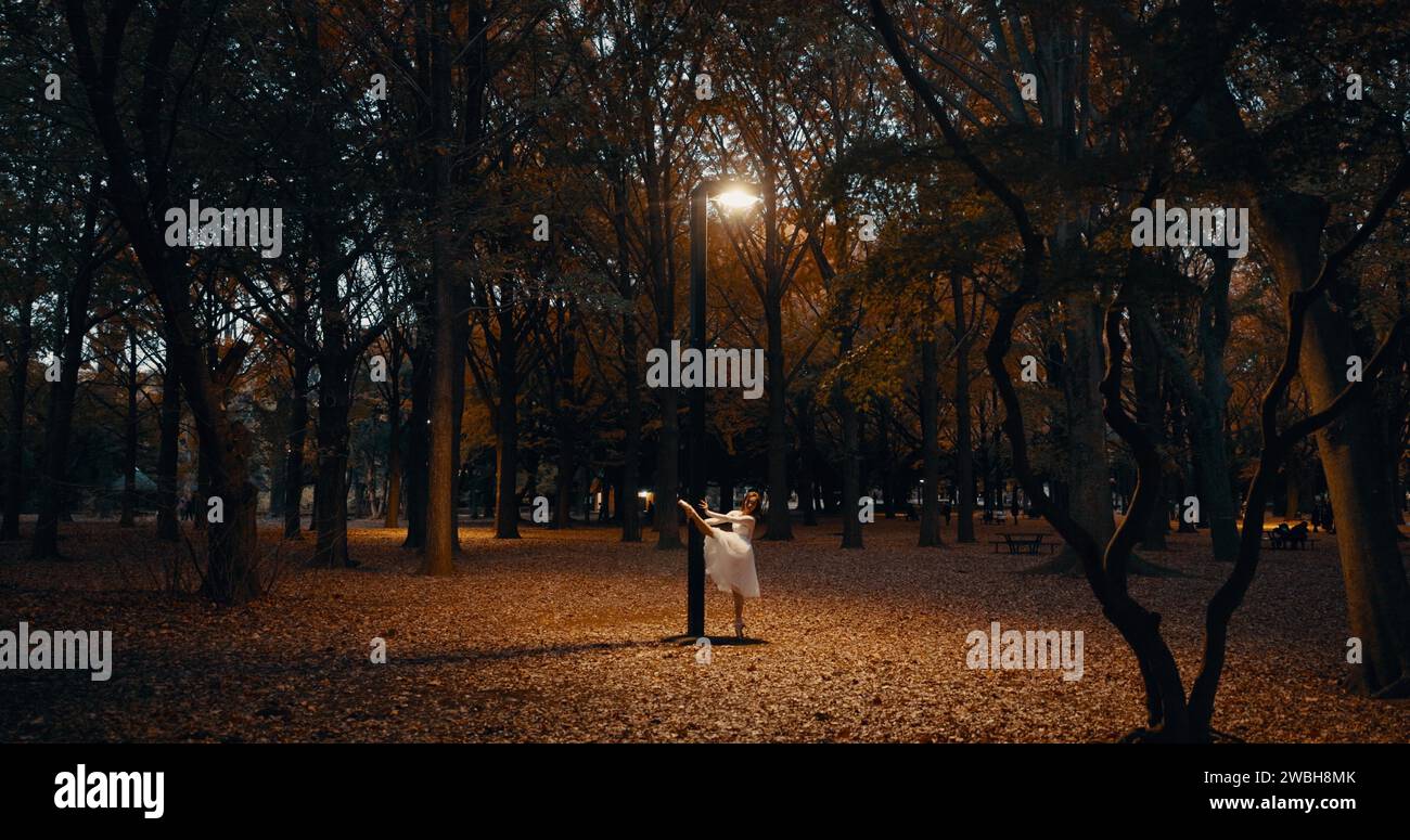 Woman, dance and night in outdoor dark at street light for performance ...