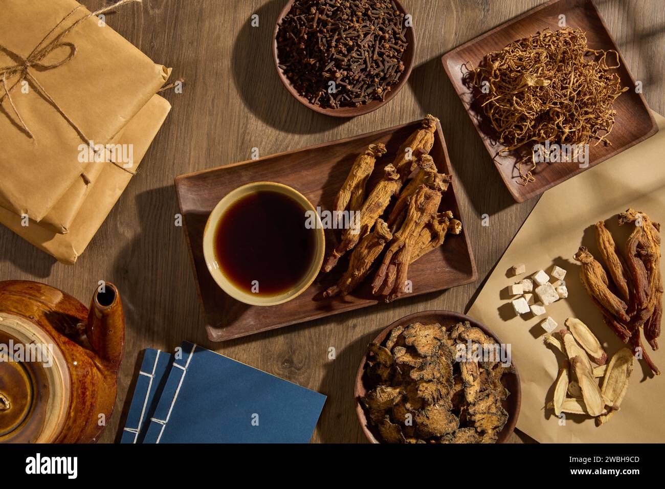 A wooden dish in rectangle-shaped featured a bowl of tonic and Red ...
