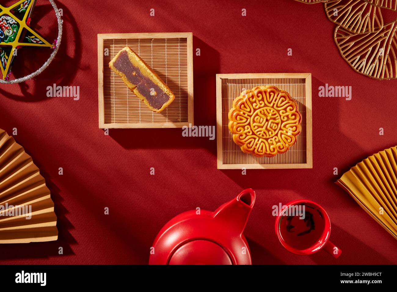 Square trays featured a full mooncake and a mooncake cut in half. Red ...