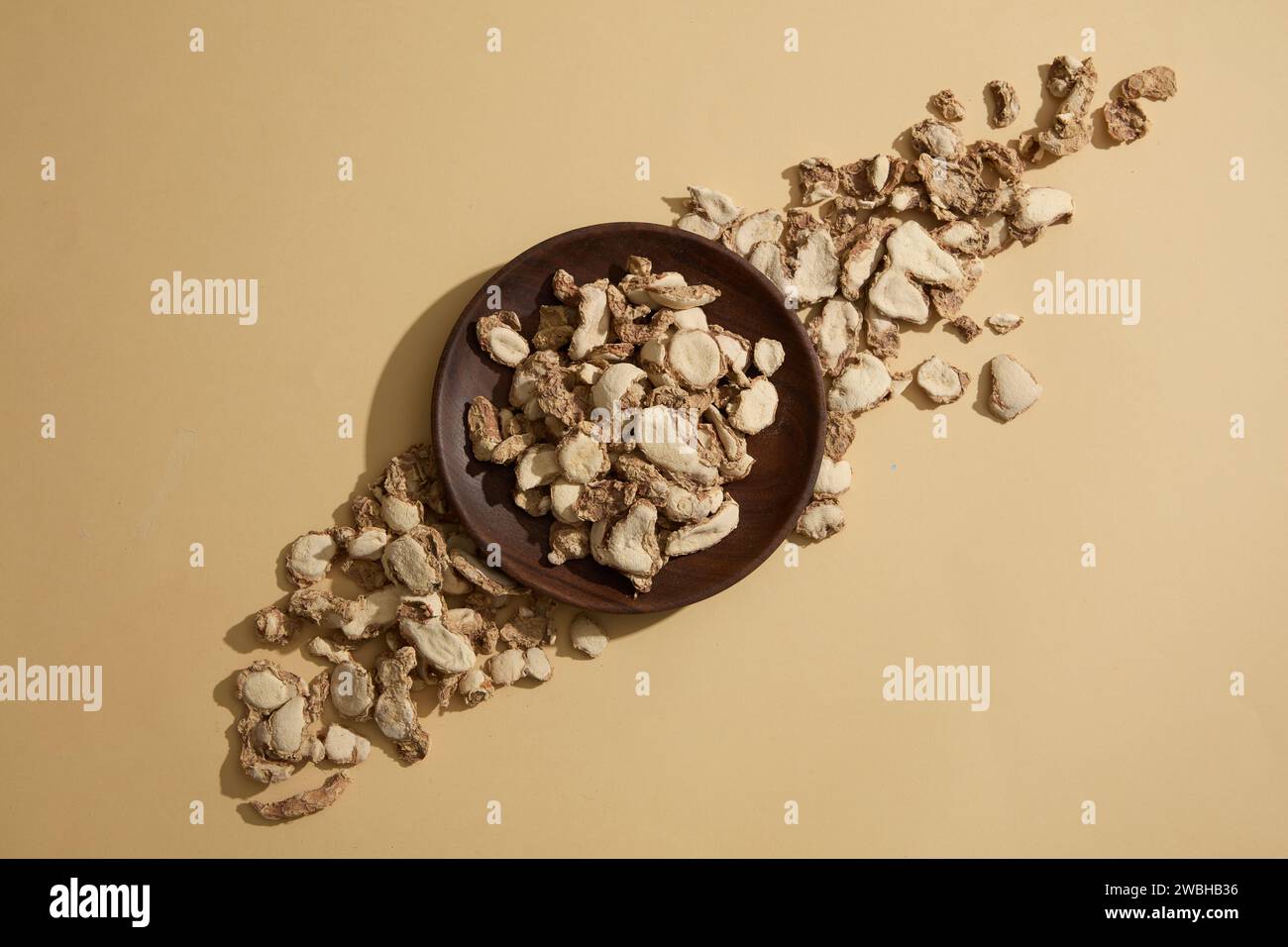 Sand Ginger displayed on a wooden dish against the beige background ...