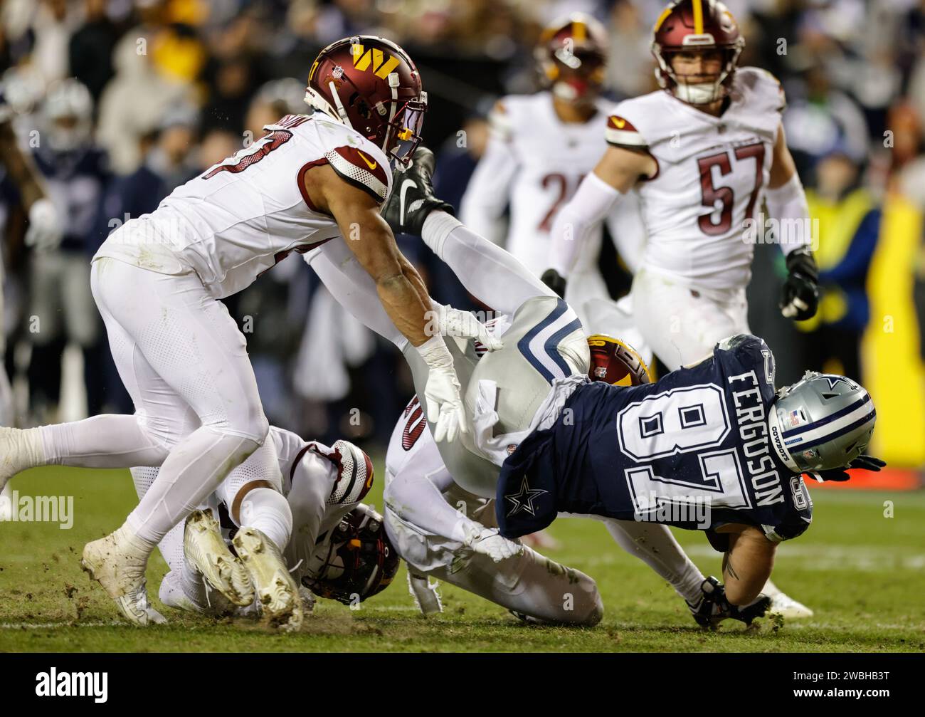 Dallas Cowboys tight end Jake Ferguson (87) tripped up by the ...