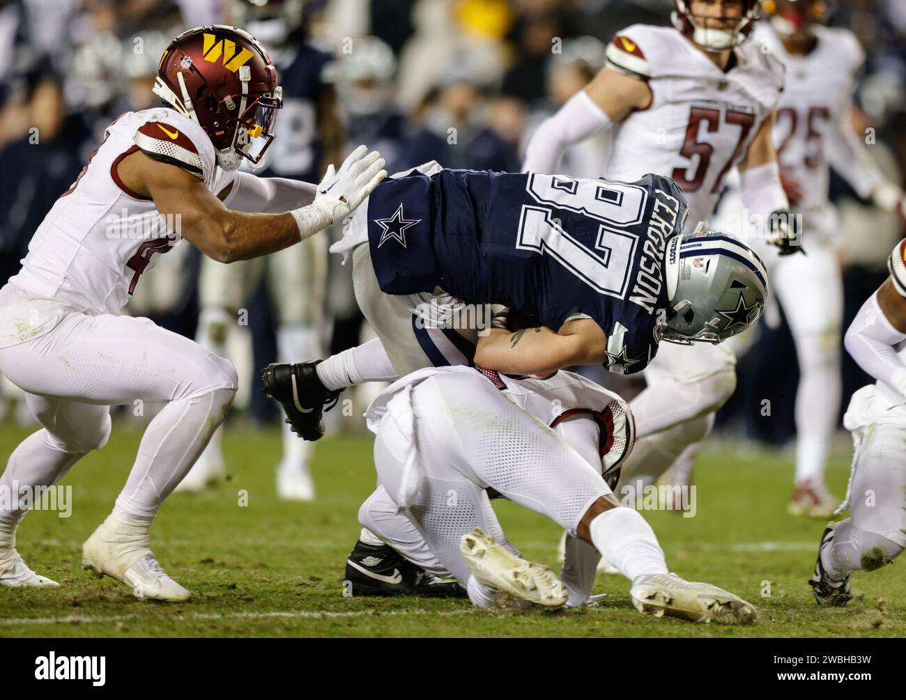 Dallas Cowboys tight end Jake Ferguson (87) tripped up by the ...