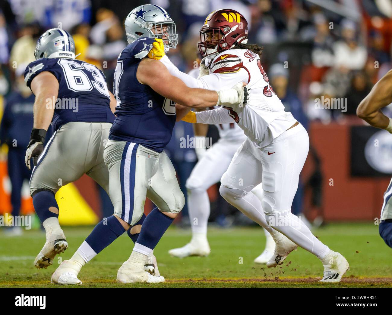 Washington Commanders defensive end James Smith-Williams (96) grabs ...