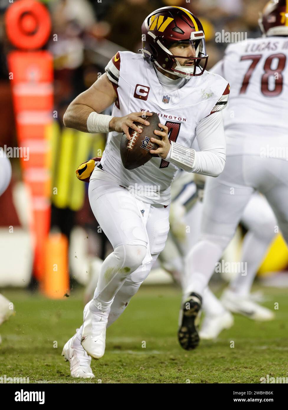 Washington Commanders quarterback Sam Howell (14) with the carry ...
