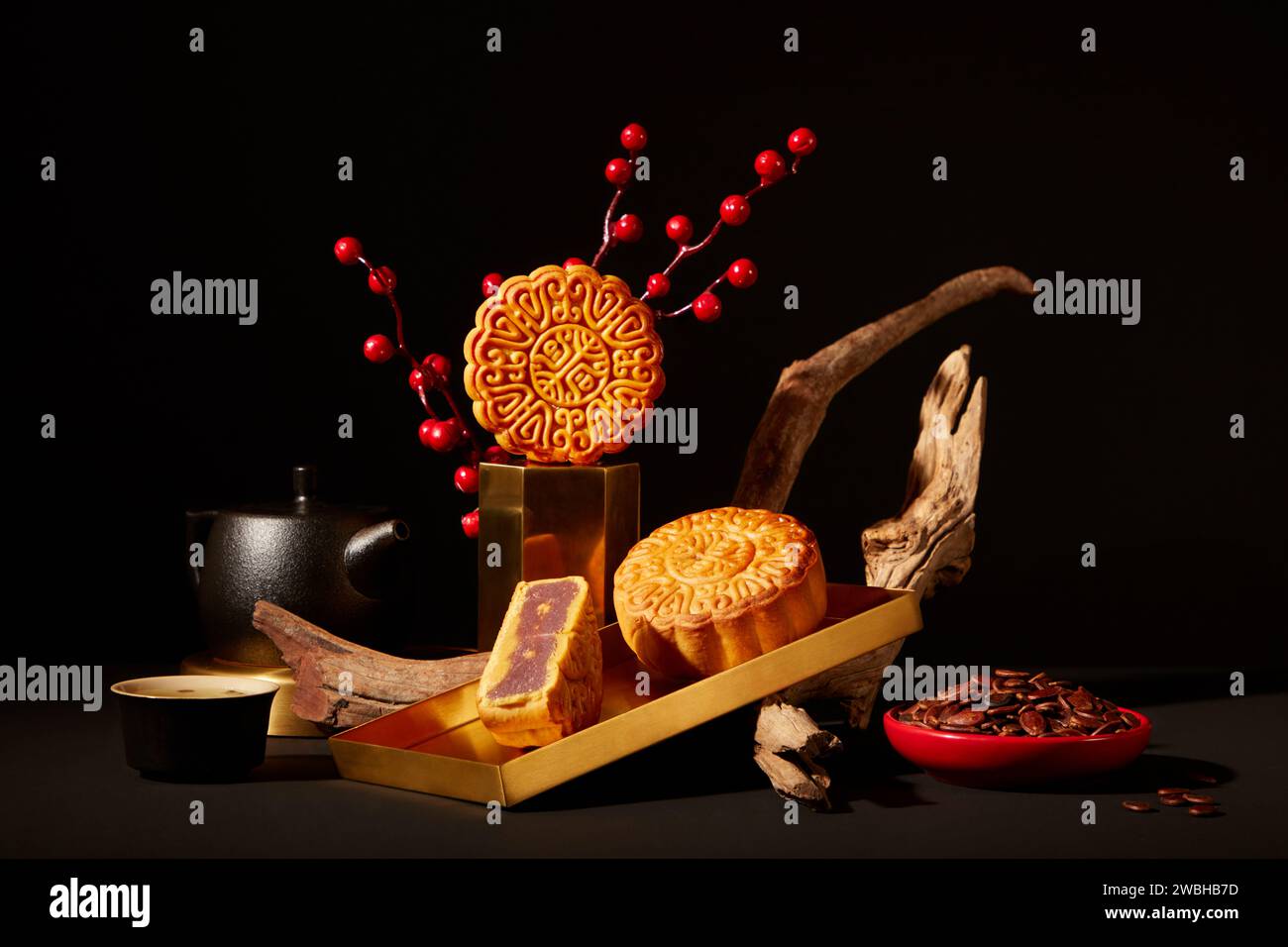 Front view of round-shaped mooncakes placed on golden tray. Tree ...