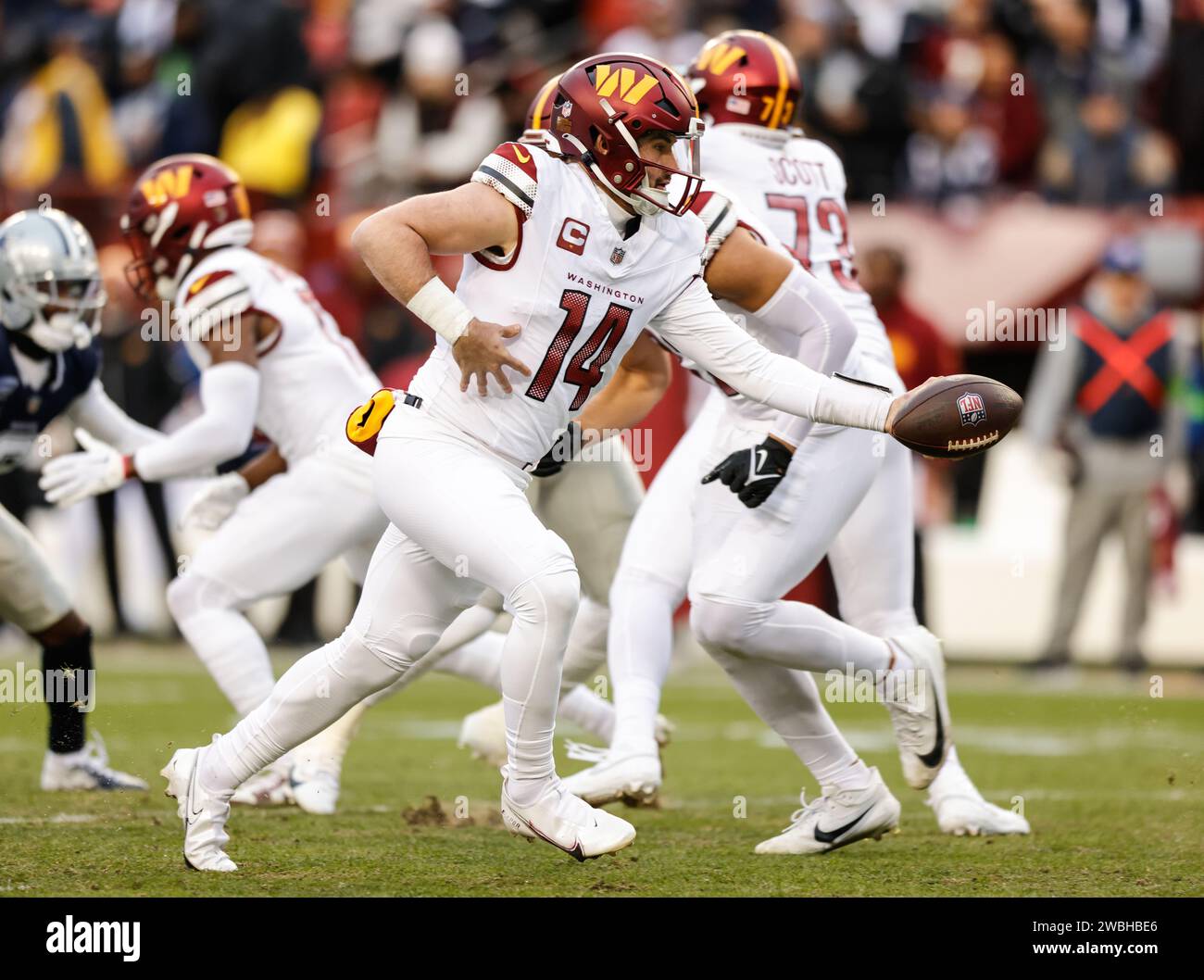 Washington commanders quarterback sam howell 14 receives snap hi-res ...
