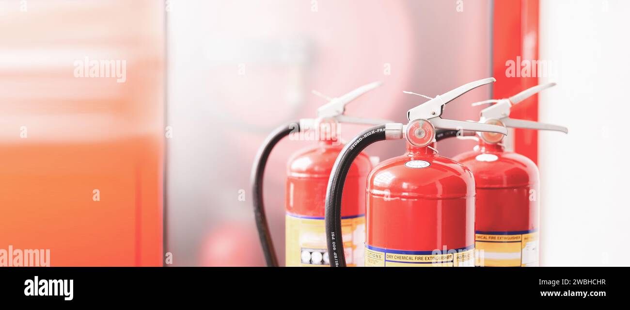 The red fire extinguisher is ready for use in case of an indoor fire ...