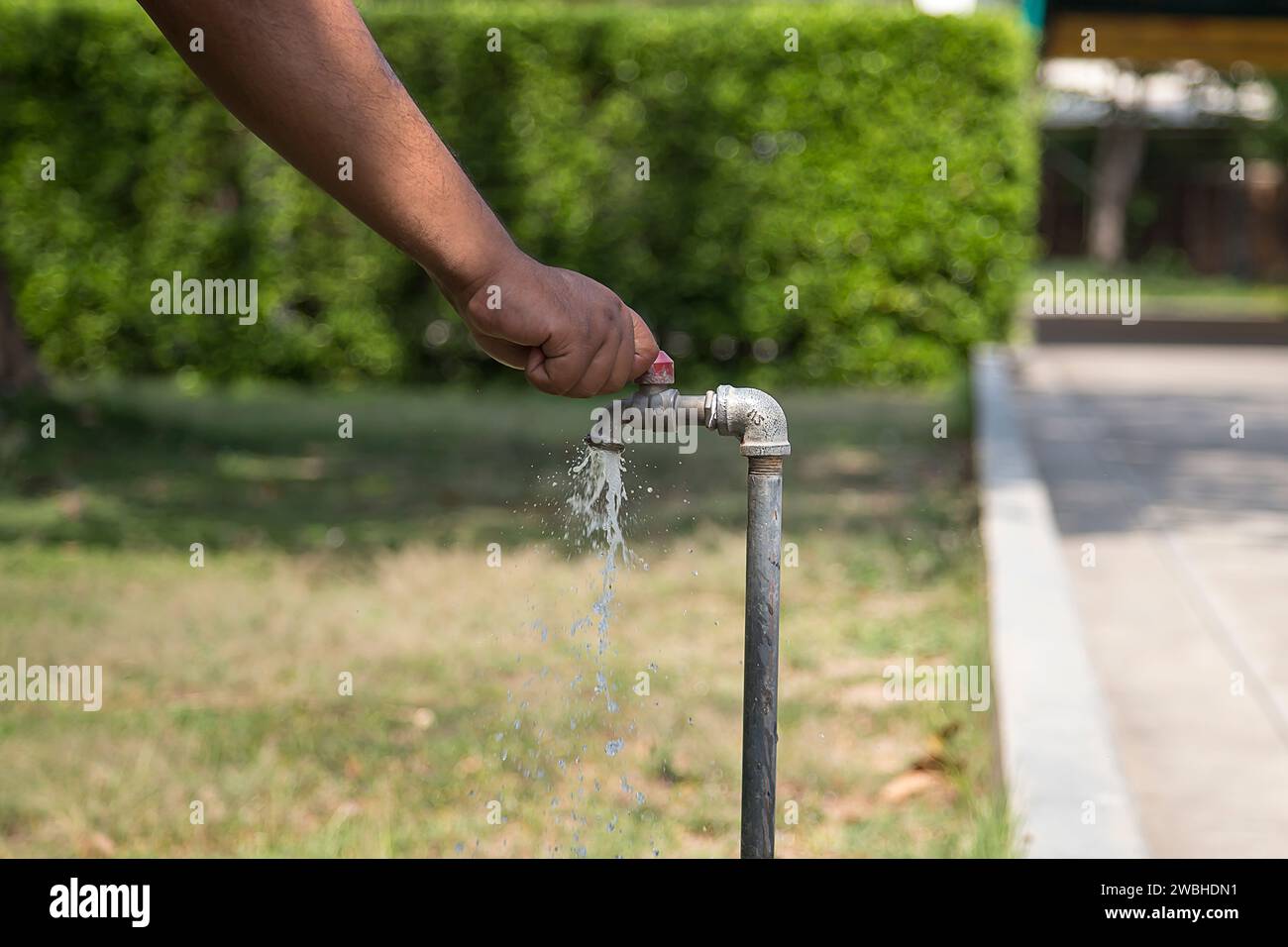 Old faucet outside the house dripping Stock Photo - Alamy
