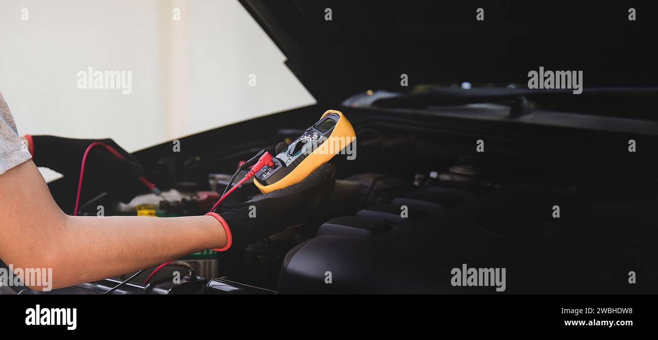 Auto mechanic Check batteries, repair, and replace engine parts Stock ...