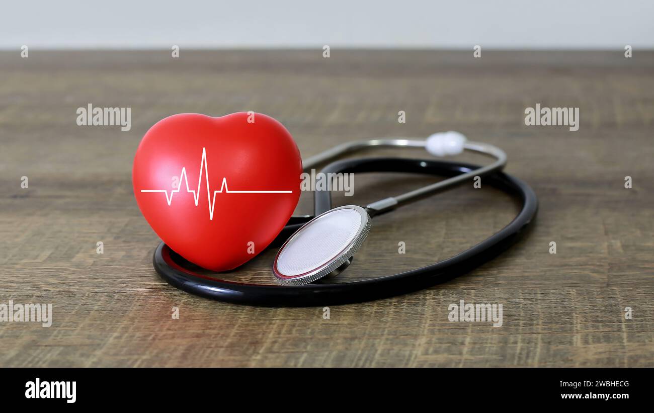 Stethoscope and heart examination red on old wooden floor health care ...