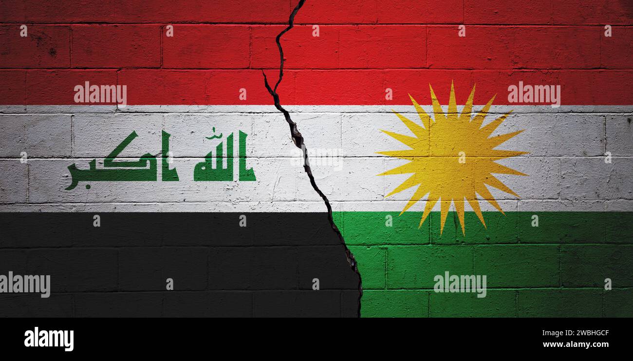 Cracked brick wall painted with a Iraqi flag on the left and a Kurdish ...