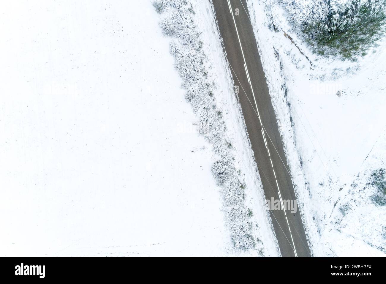 aerial overhead drone view of a highway in a snowy landscape Stock ...