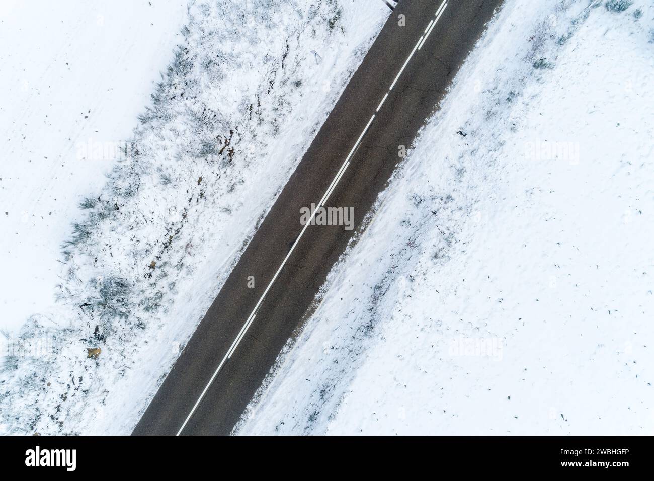 aerial zenithal drone view of a road in a snowy landscape Stock Photo ...