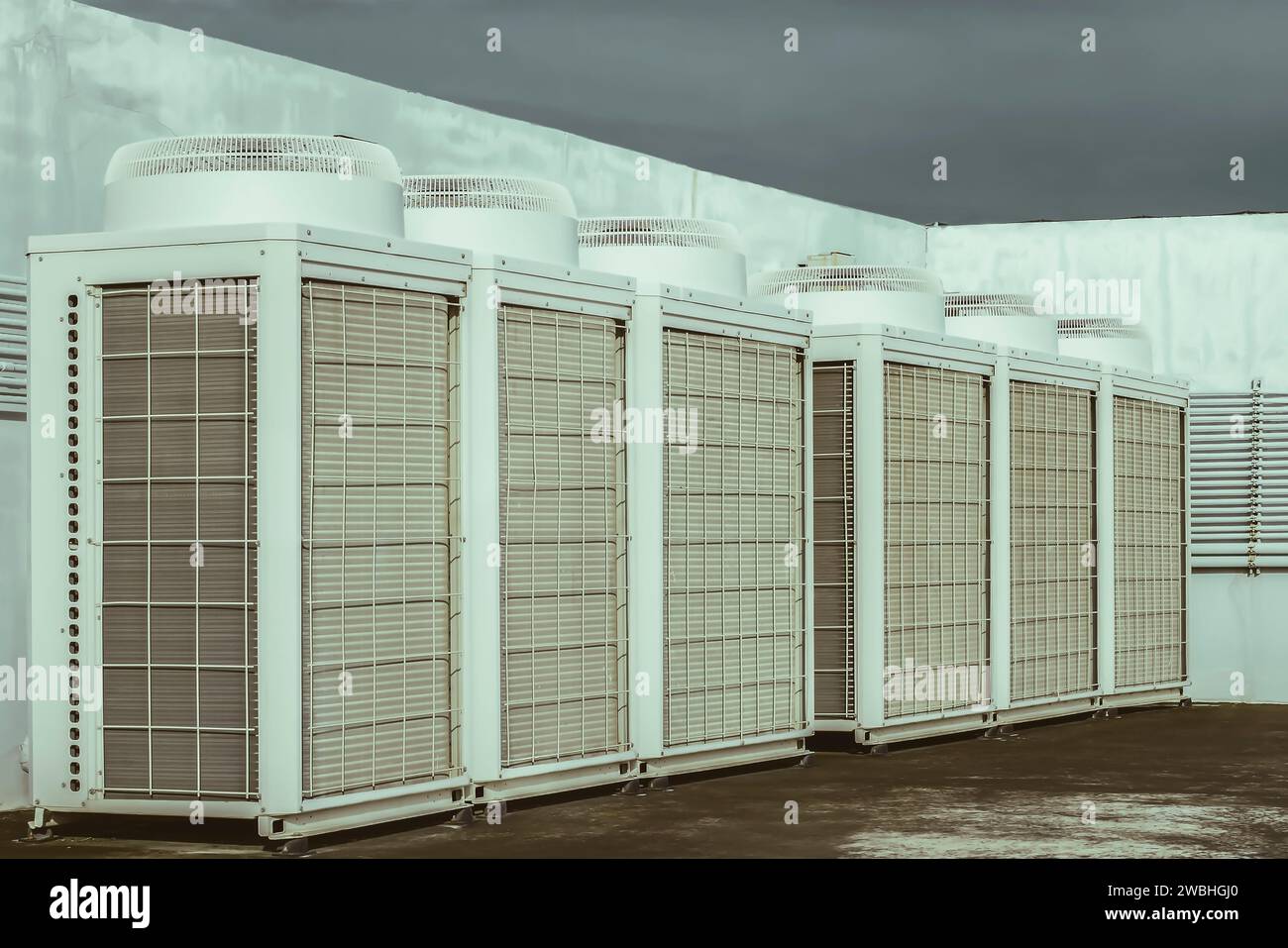 Air conditioning (HVAC) on the roof of an industrial building with blue ...