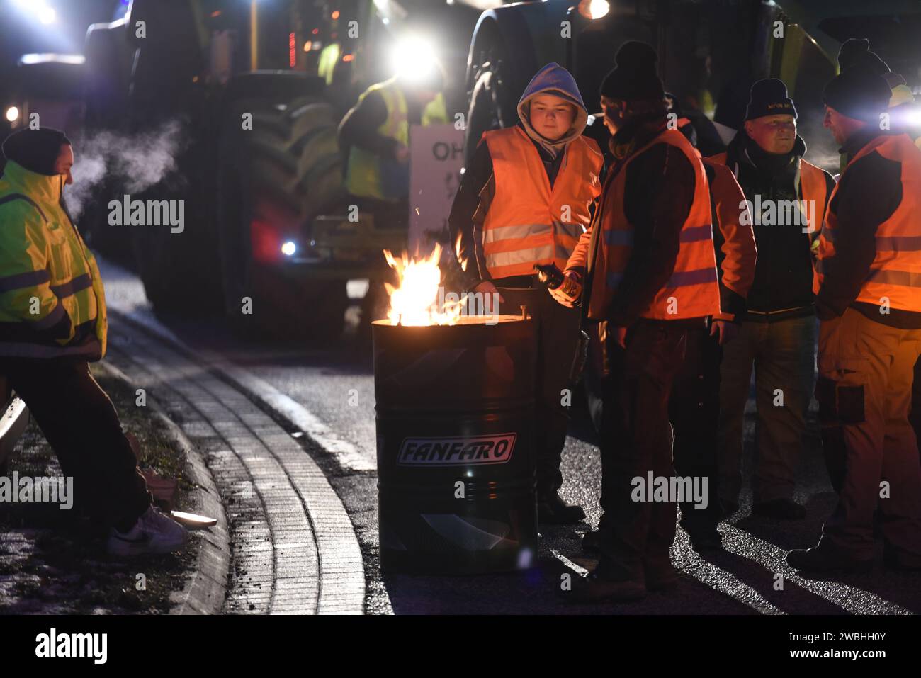 Rostock, Germany. 11th Jan, 2024. Convoys of tractors block the Rostock ...